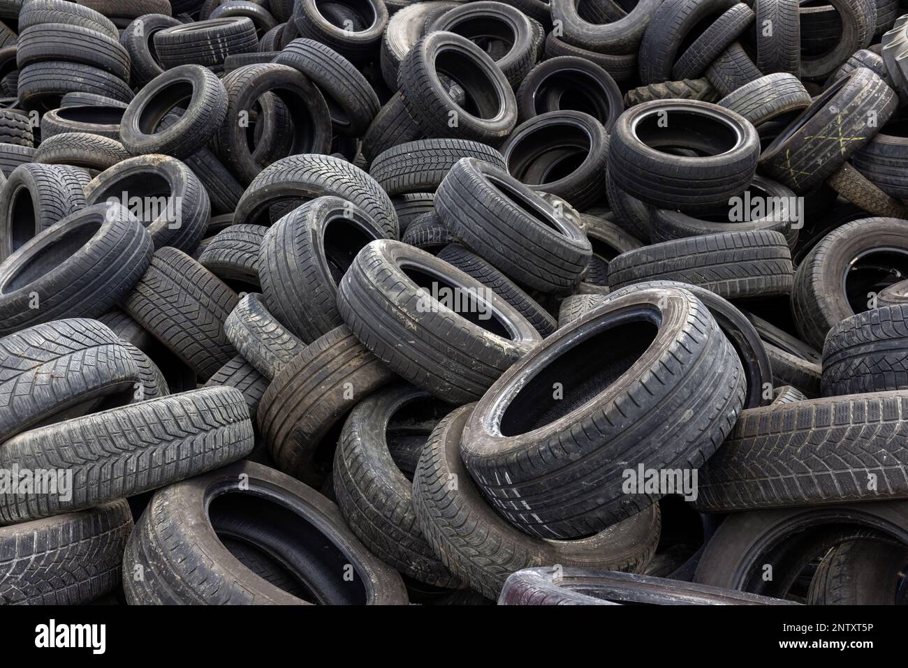 Waste disposal, a stack of end-of-life automobile and truck tires ...