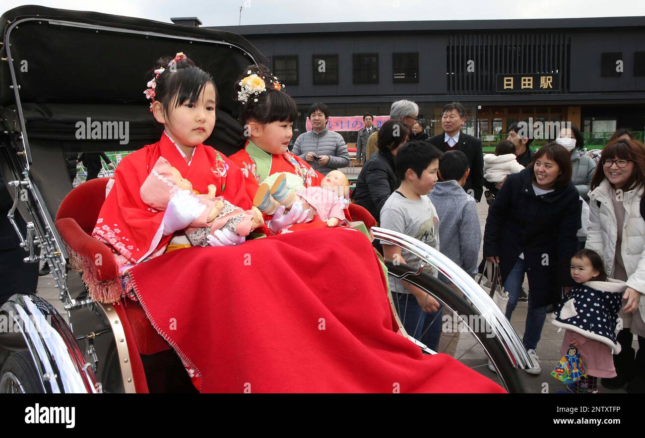 Girls in Kimono carrying blue-eyed dolls parade during the annual Hita ...