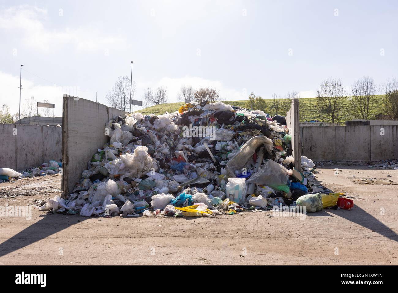 Landfill site, a pile of stinky different junk disposal in the concrete ...
