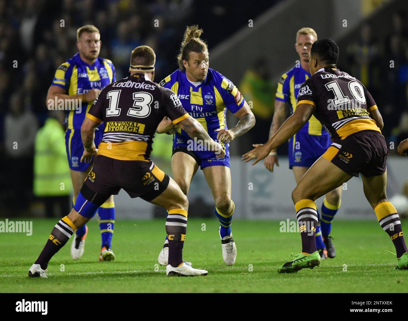 Warrington Wolves ASHTON SIMS runs at the Brisbane Broncos defence ...