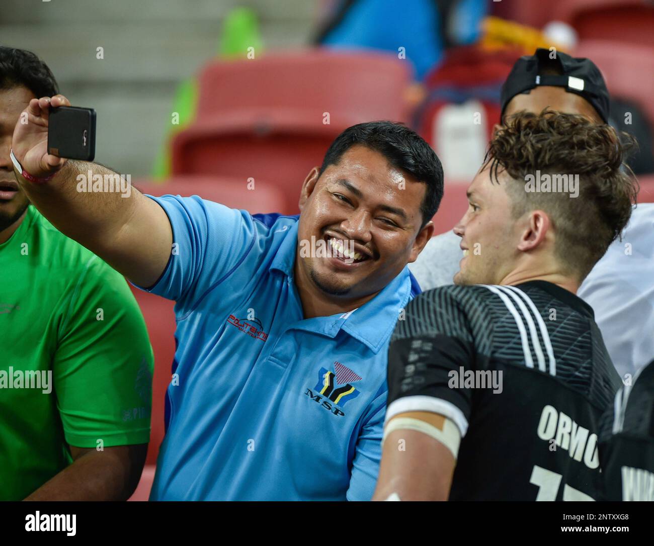 New Zealand's Lewis Ormond poses for selfie's with fans after the HSBC World Rugby Sevens Series ...