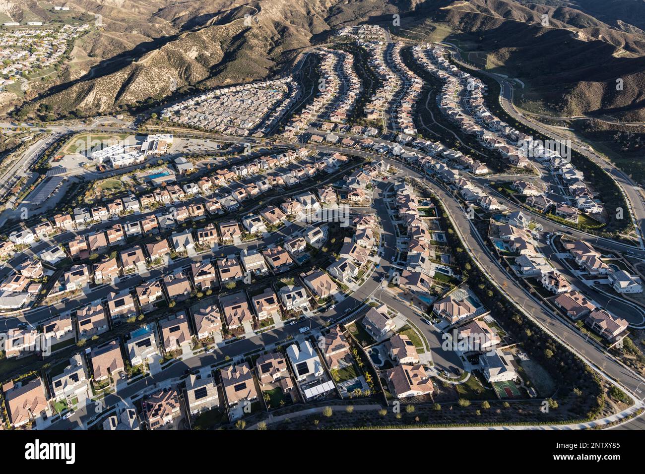 Aerial cityscape view of suburban tract homes with solar rooftops in ...
