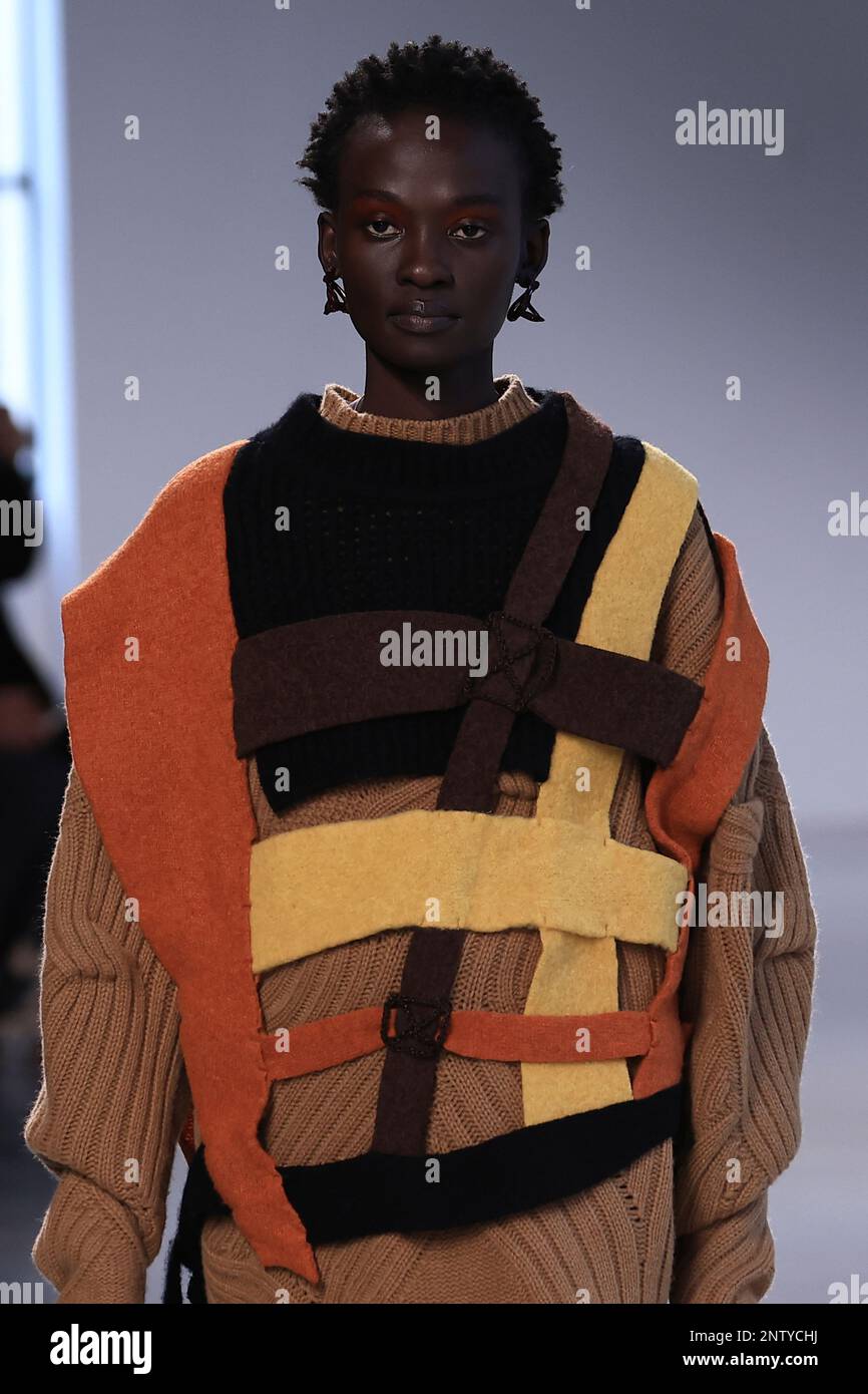 A model wears a creation for the Mame Kurogouchi Fall/Winter 2023-2024 ...