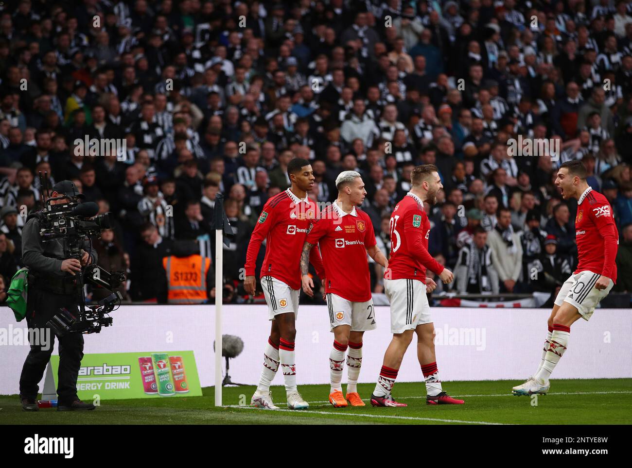 TV Cameraman is seen as Manchester United player celebrate a goal scored by Marcus Rashford of ...
