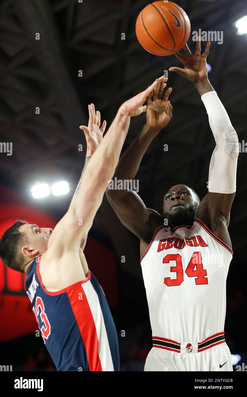 Georgia forward Derek Ogbeide (34) takes a shot over Mississippi center ...