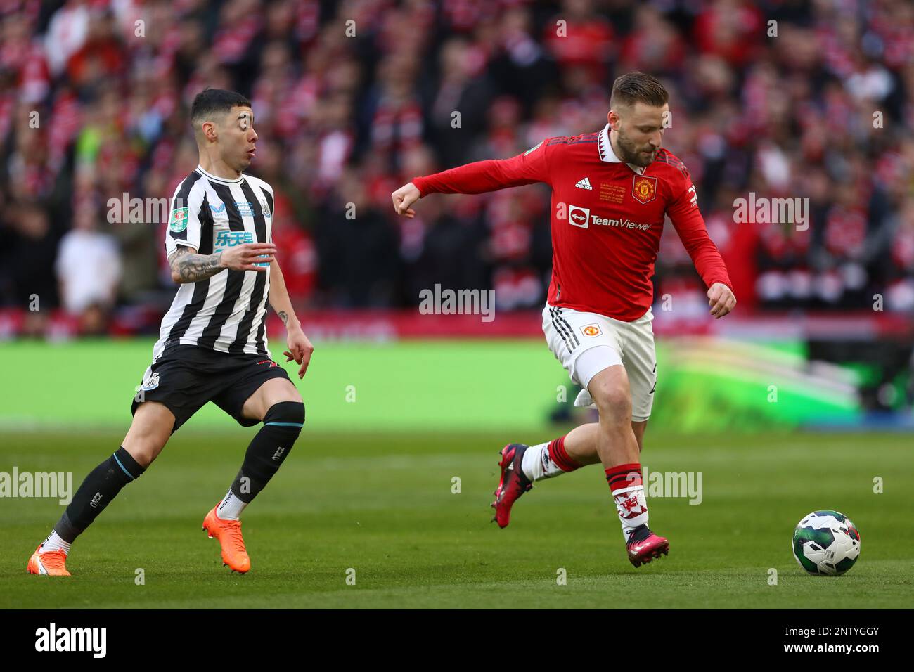 Luke Shaw of Manchester United and Miguel Almiron of Newcastle United - Manchester United v ...