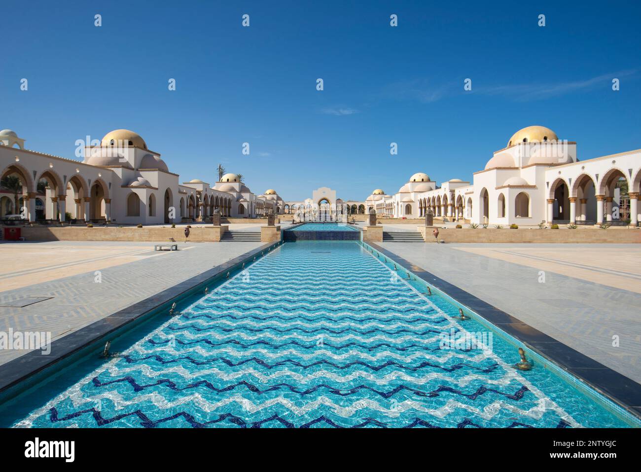 Large water feature river in a tropical resort piazza courtyard with ...