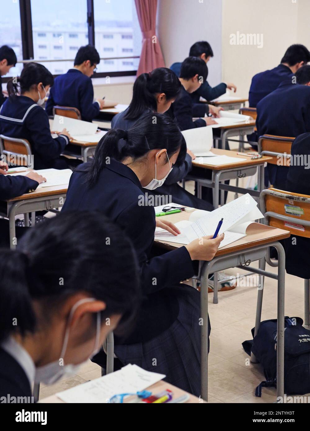 Junior haigh school students take an entrance examination for private ...
