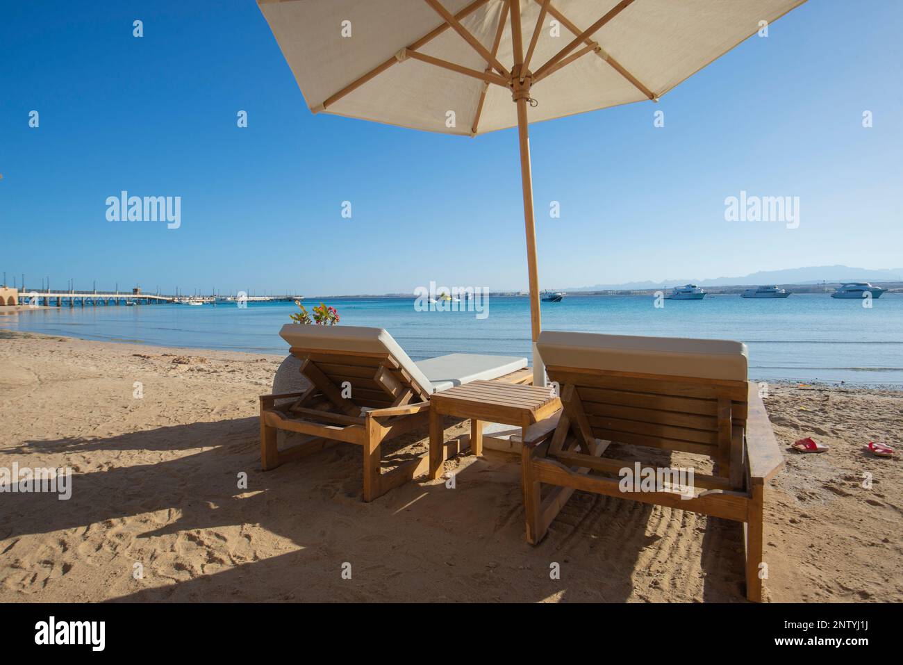 Landscape view over ocean from tropical hotel resort beach with sun ...