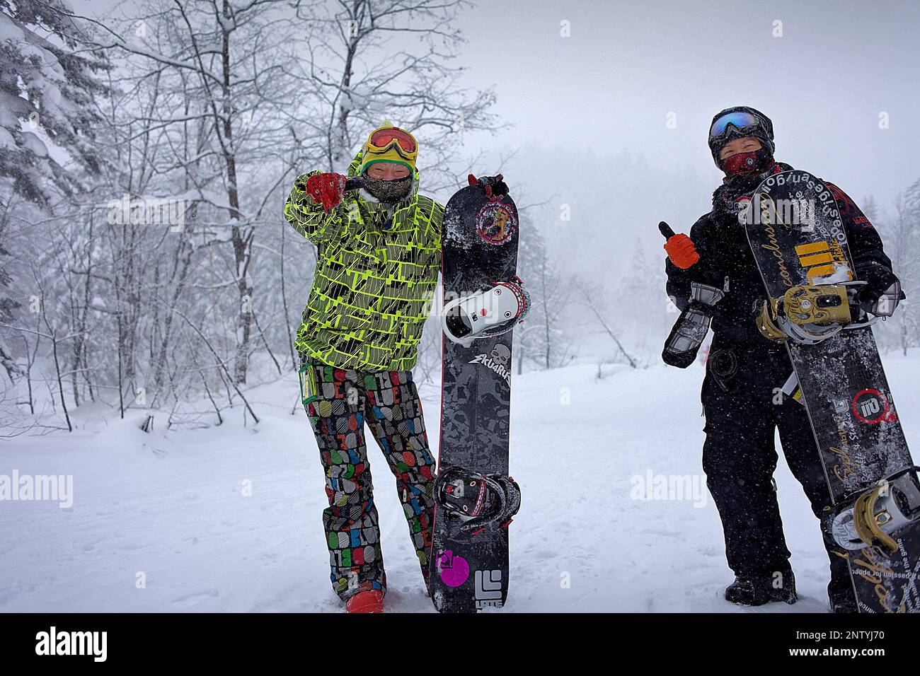 Two men with snowboards in Asahidake, Daisetsuzan National Park ...