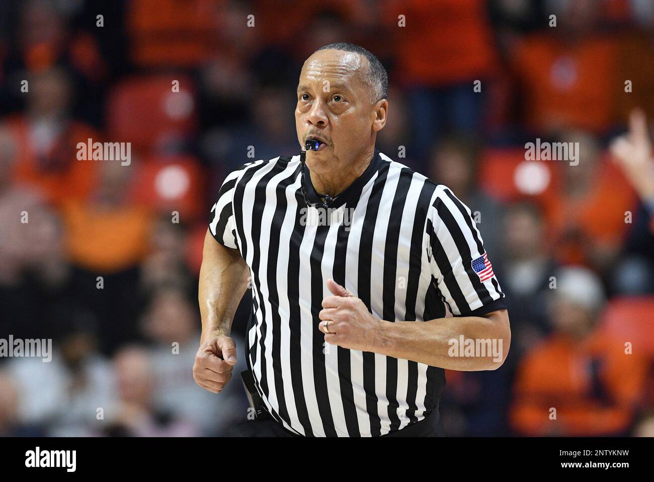CHAMPAIGN, IL - FEBRUARY 05: Big Ten referee Lamont Simpson runs across ...