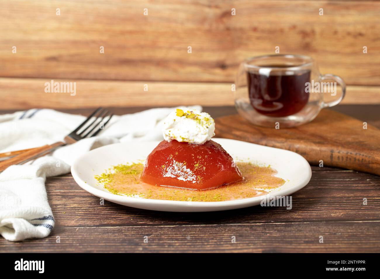 Quince dessert with sorbet on a gray background. Creamy quince dessert ...