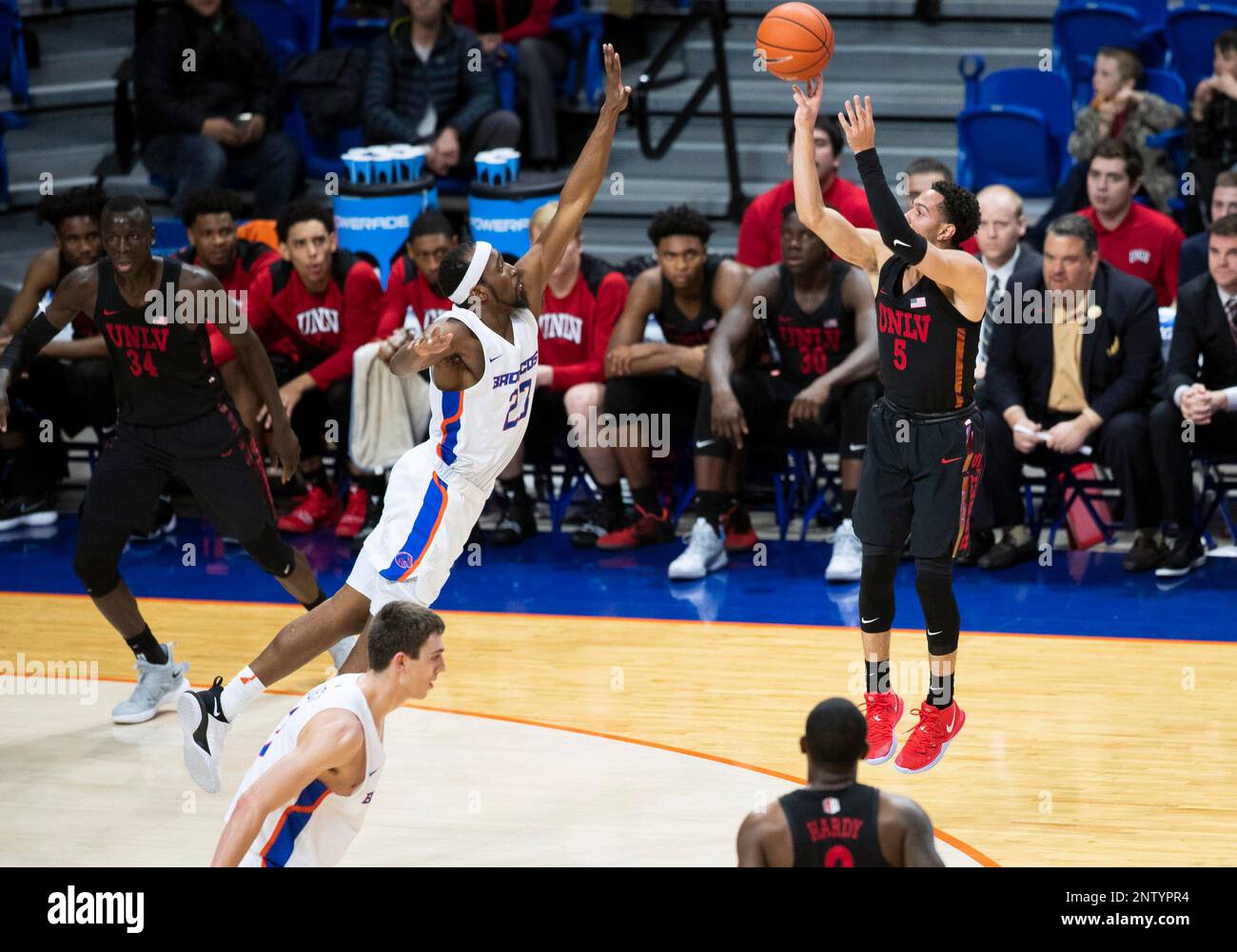 UNLV guard Noah Robotham pulls up for a 3-pointer while defended by ... UNLV guard Noah Robotham pulls up for a 3-pointer while defended by ...