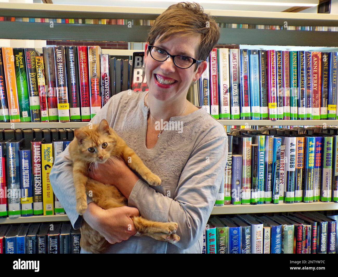 In this Feb. 1, 2019 photo, library director Mara Edler poses with cat ...