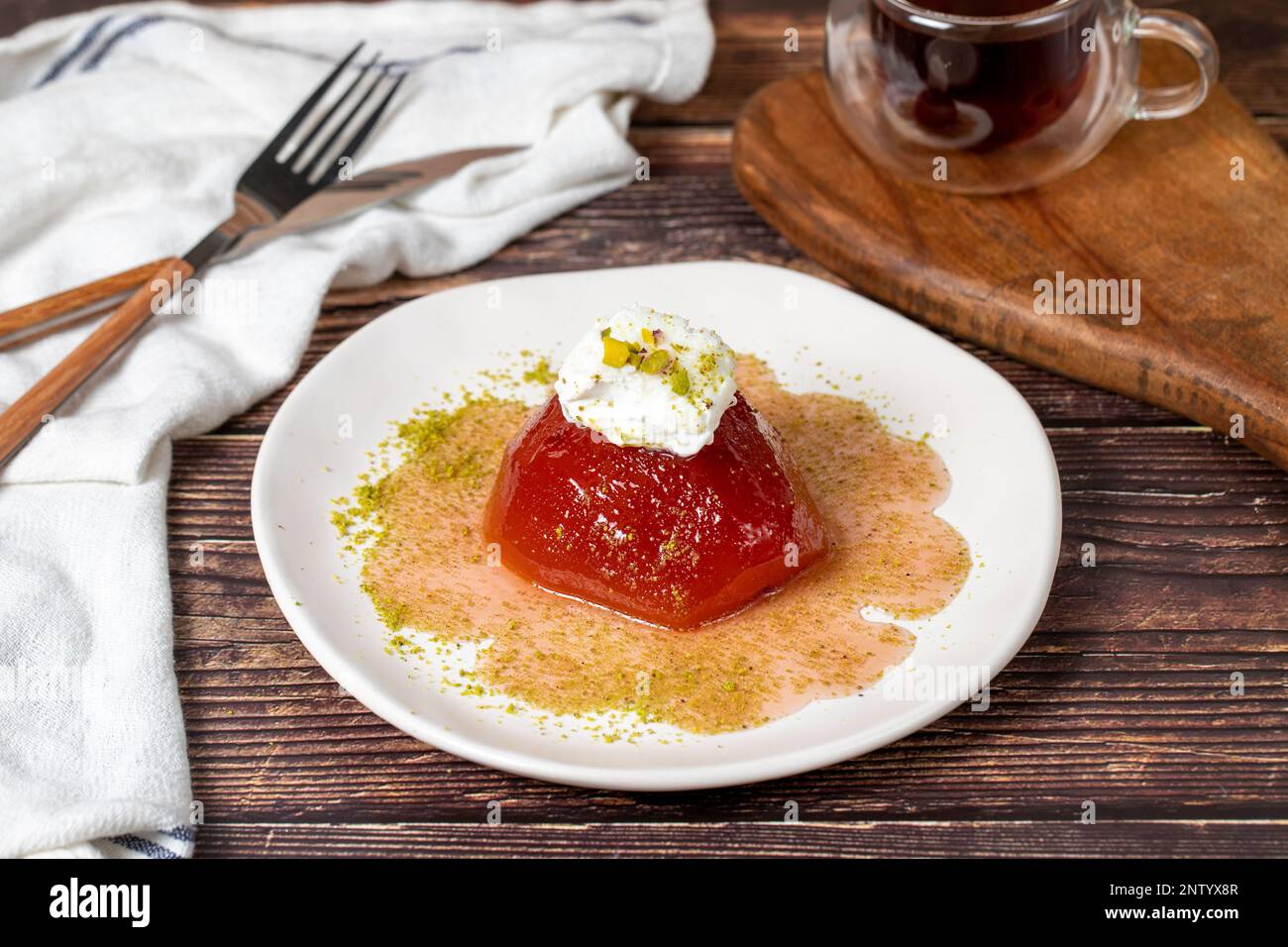 Quince dessert with sorbet on a gray background. Creamy quince dessert ...