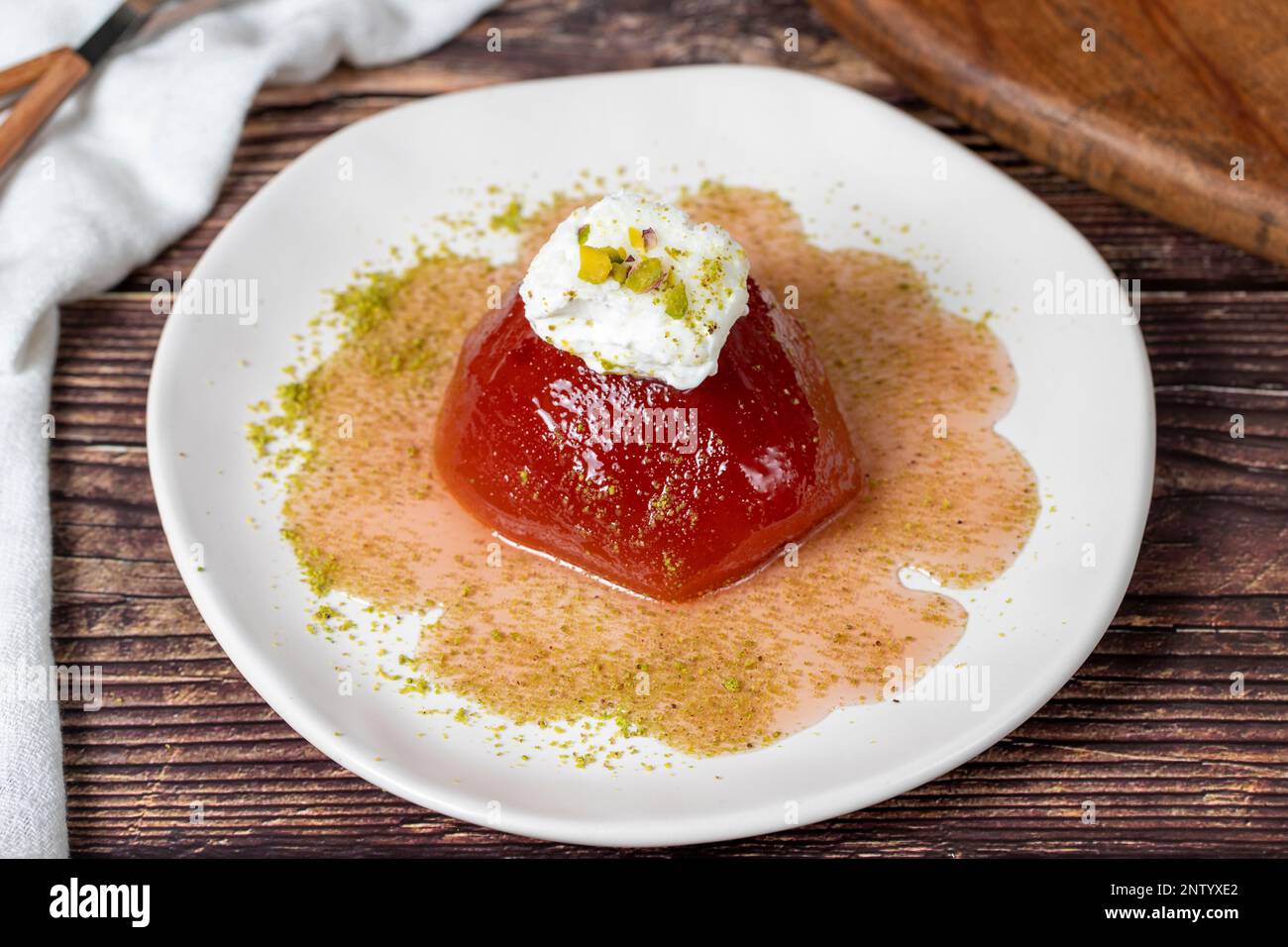 Quince dessert with sorbet on a gray background. Creamy quince dessert ...