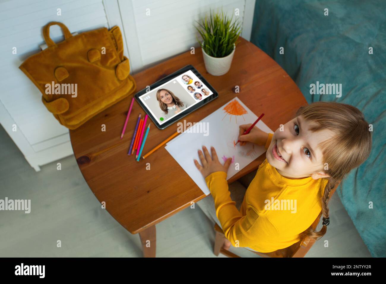 Portrait of adorable child with digital tablet. Remote education ...