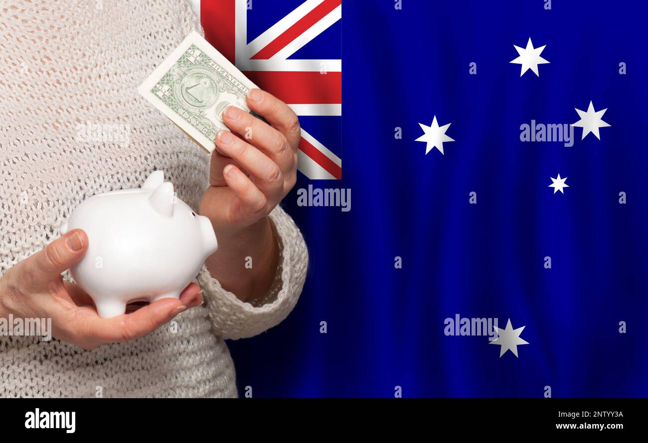 Australian money woman piggy bank hi-res stock photography and images ...