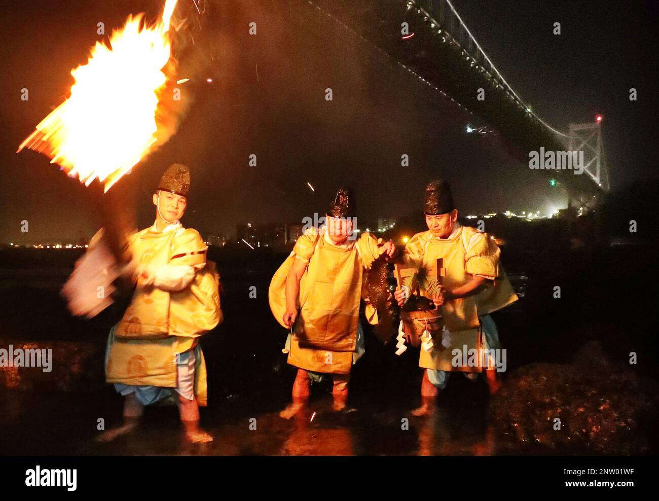 Shrine priests clad in ceremonial robes conduct a Mekari Shinji, shinto ...