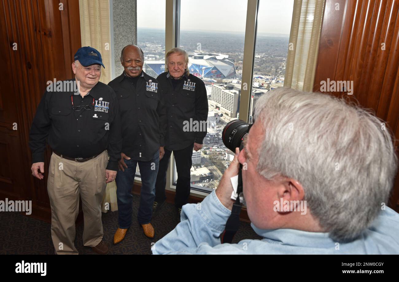 With the Mercedes-Benz Stadium in the background, members of the Never ...