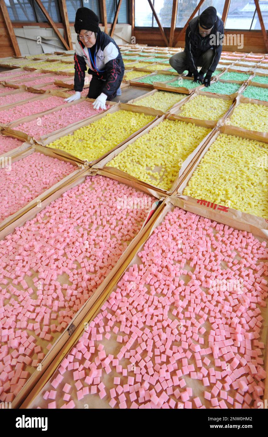 Factory workers prepare to dry dozens of colorful arare, rice crackers ...