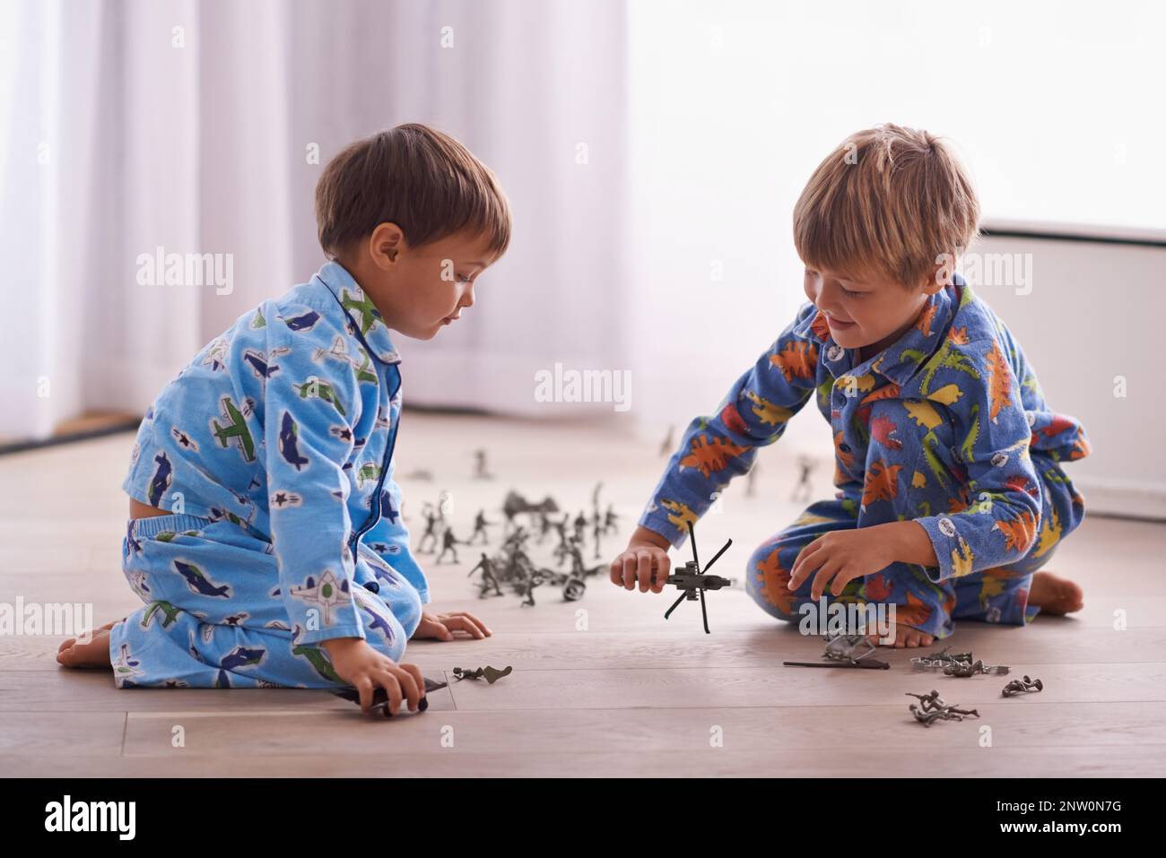 Lets fly away. Shot of two brothers playing together in their bedroom ...