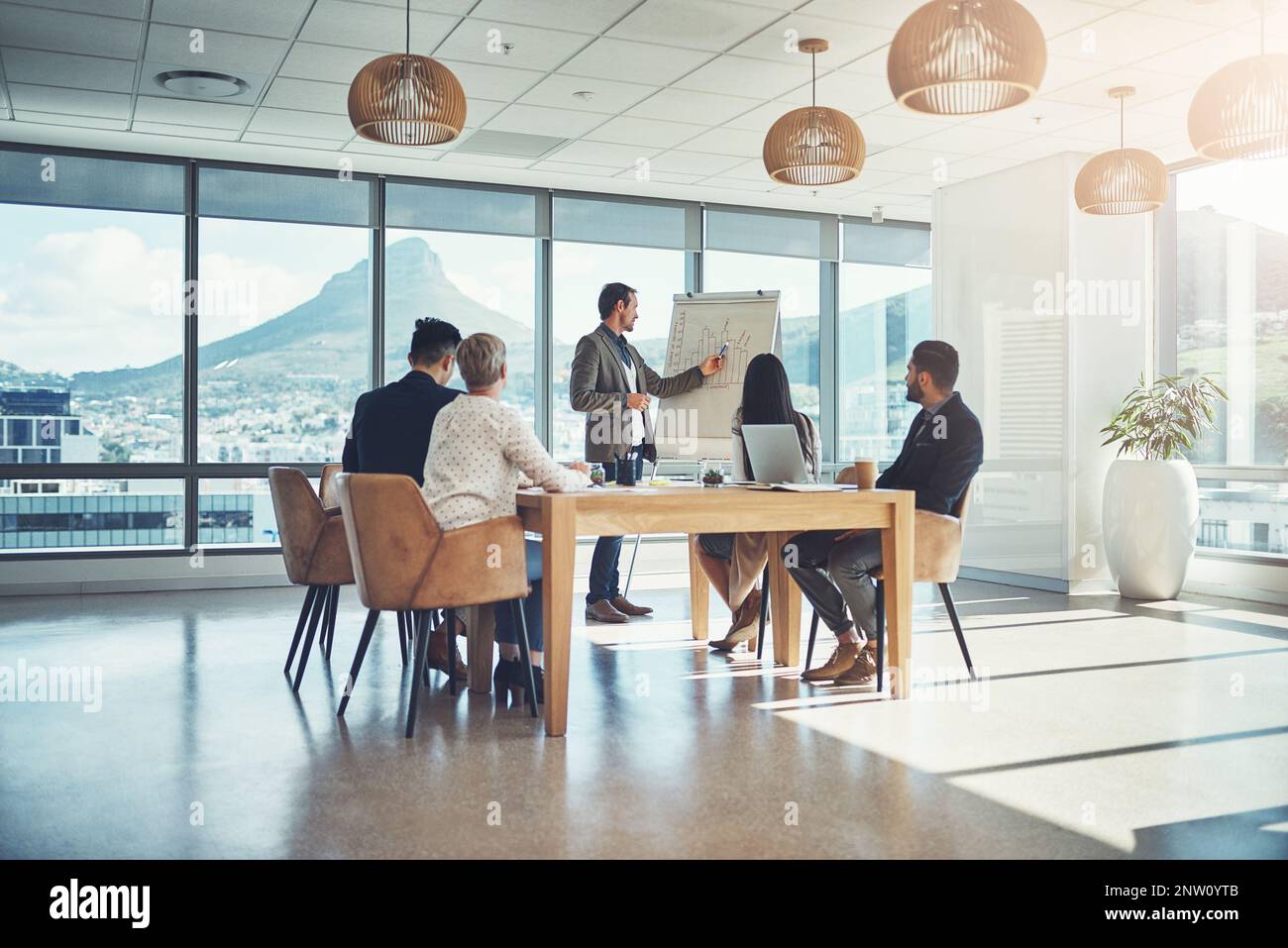 Creating a powerful action plan together. Shot of a businessman giving ...
