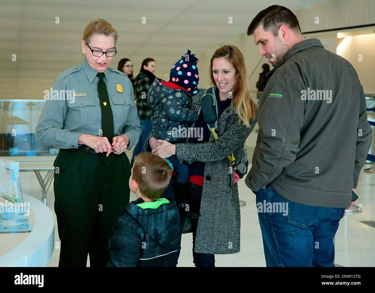 Park ranger Rhonda Schier, left, welcomes Stanley Gross, 5, his sister ...