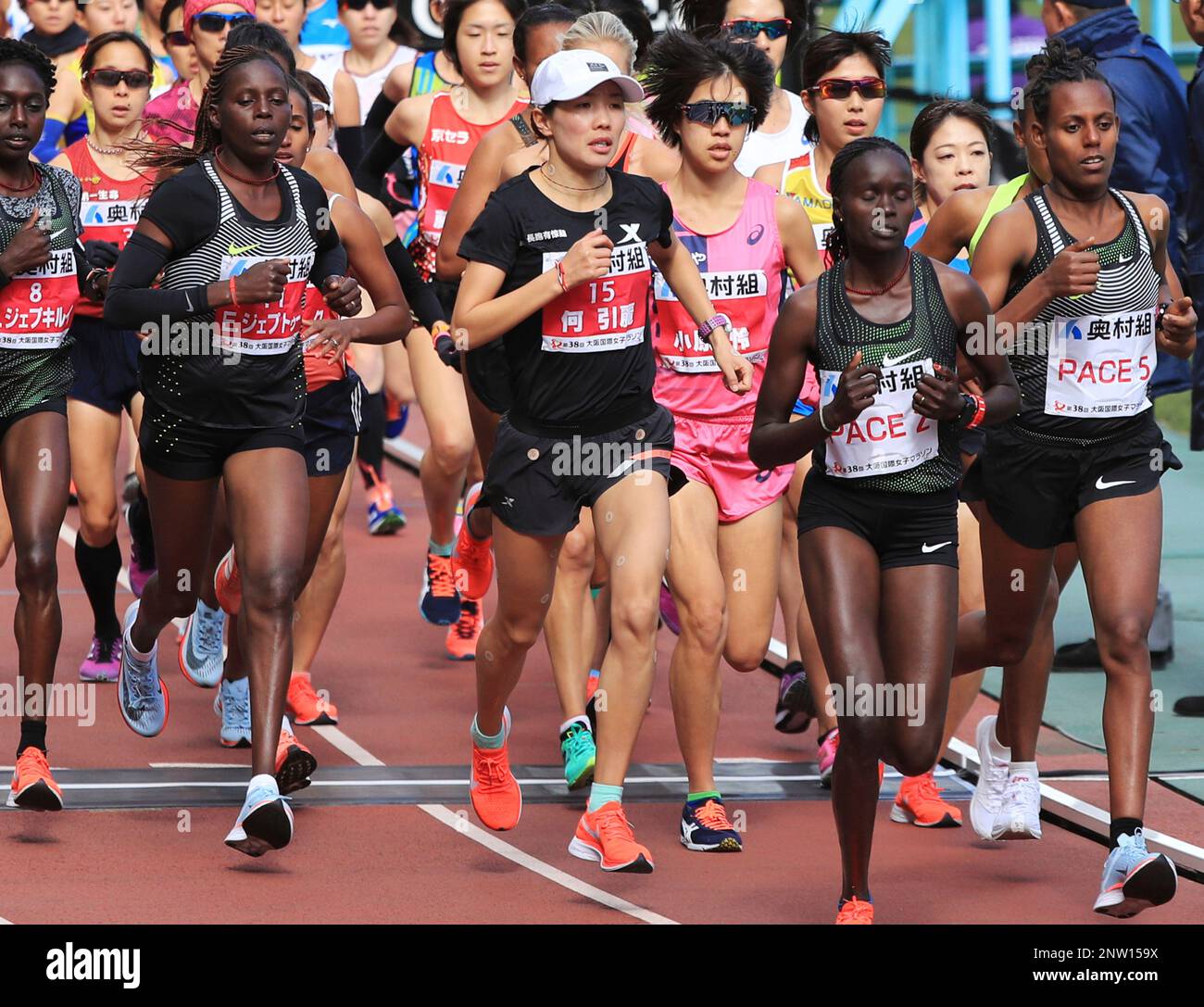 He Yinli (15), a female Chinese long-distance runner, runs just after ...