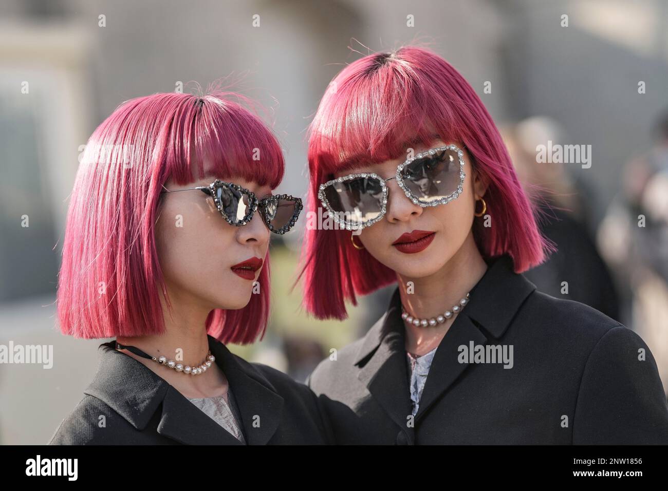 Ami and Aya pose for photographers upon arrival at the Christian Dior ...