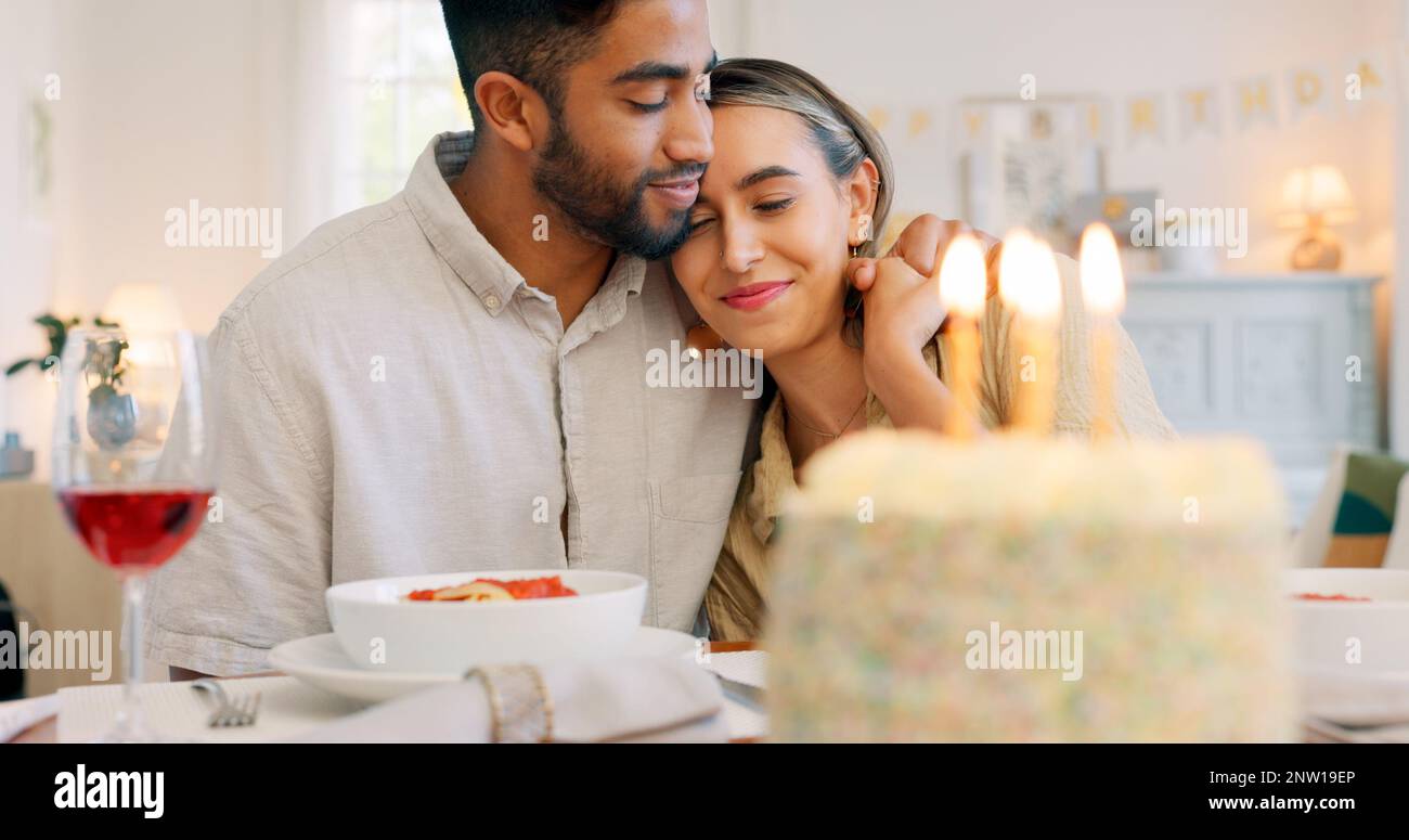 Interracial couple, gift and celebrate birthday being happy, kiss and ...