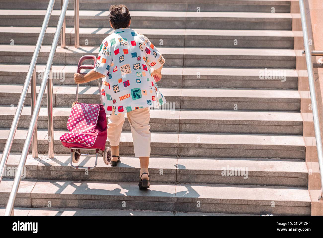 Carrying luggage up stairs hi-res stock photography and images - Alamy