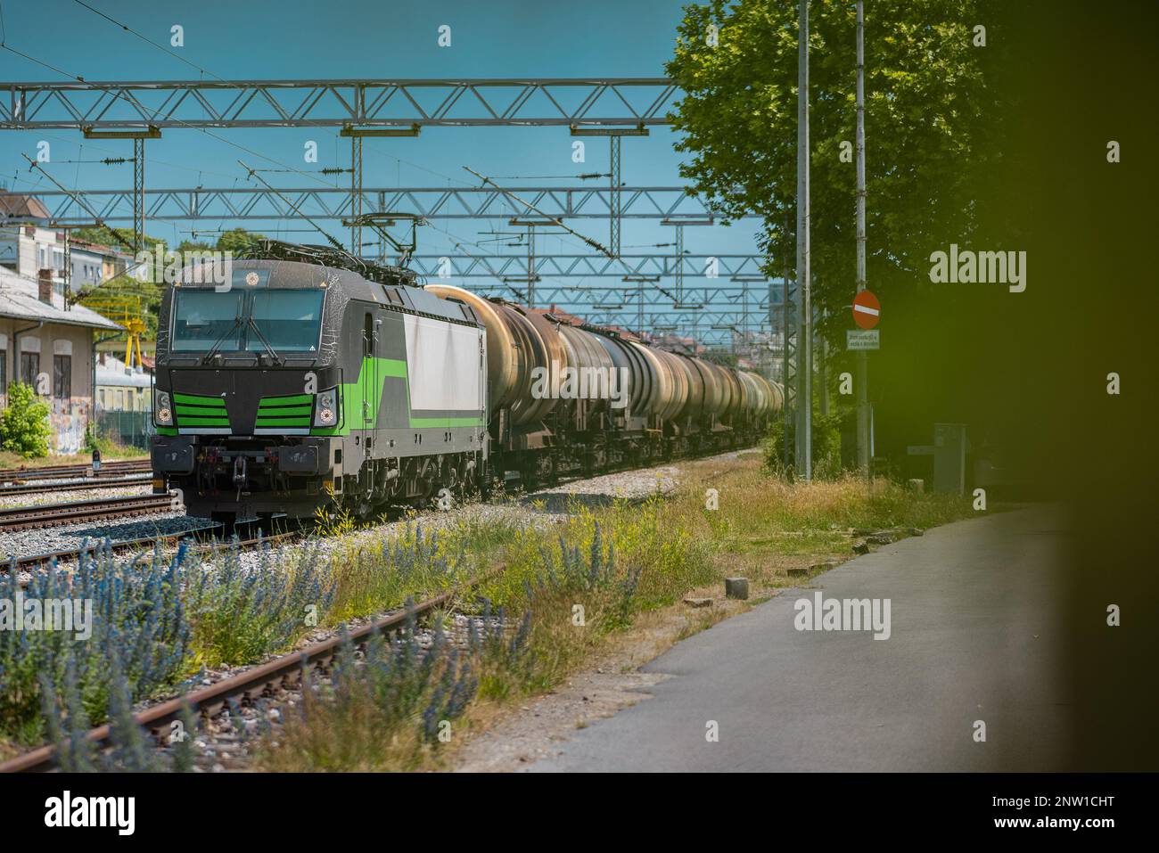 Heavy freight train with tank cars with dangerous cargo is driving ...
