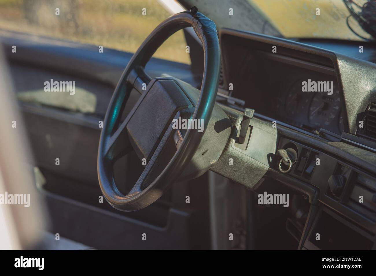 Old and worn steering wheel of an older car. Rectangular shape of ...