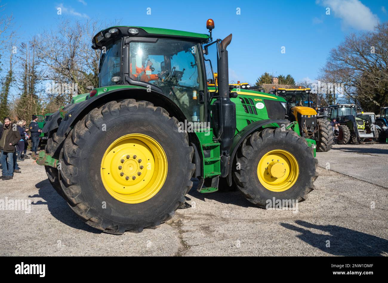 A side view of a John Deere 6215R tractor about to be parked in ...