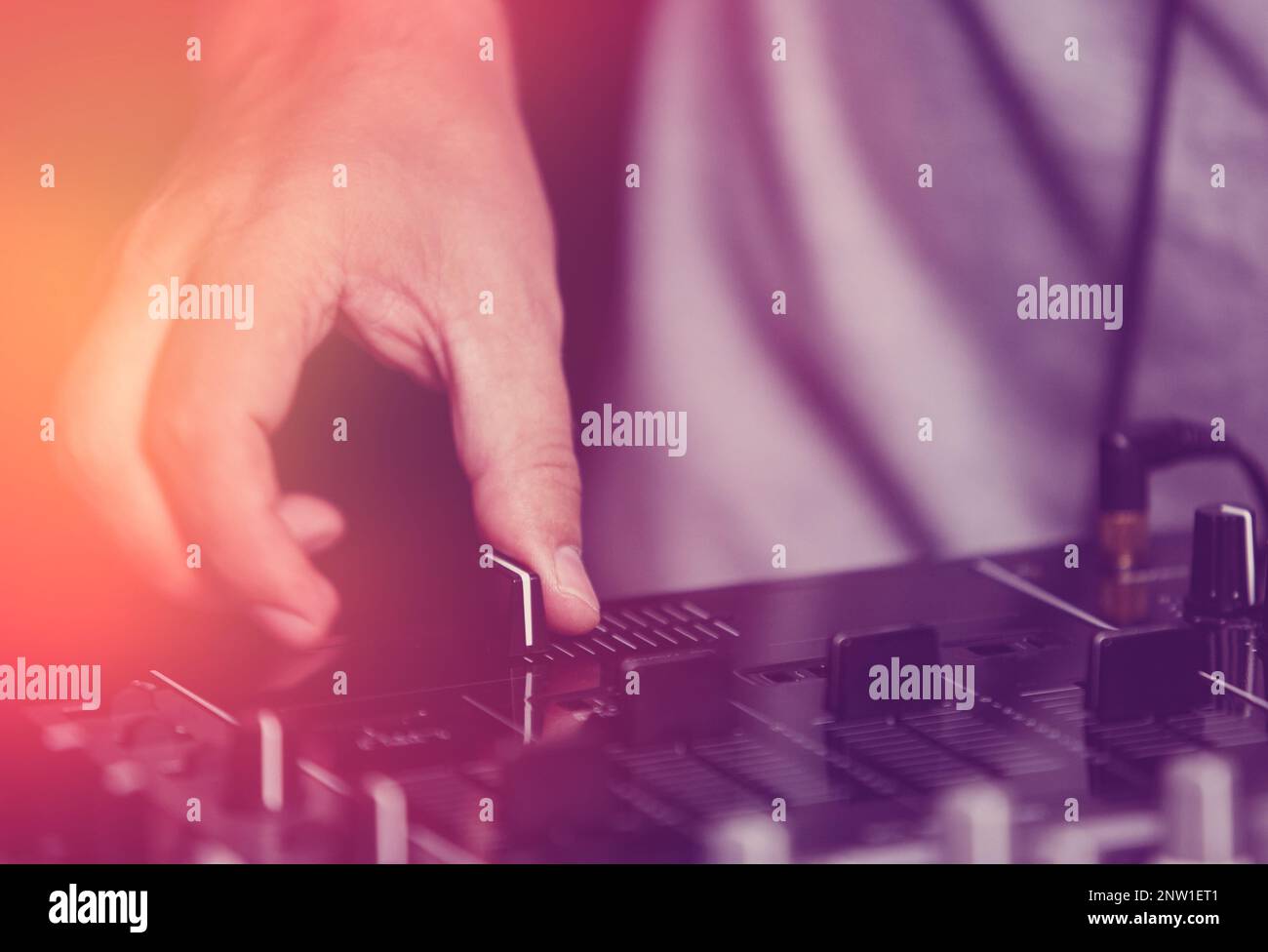 Dj plays music on party in night club with professional sound mixer ...