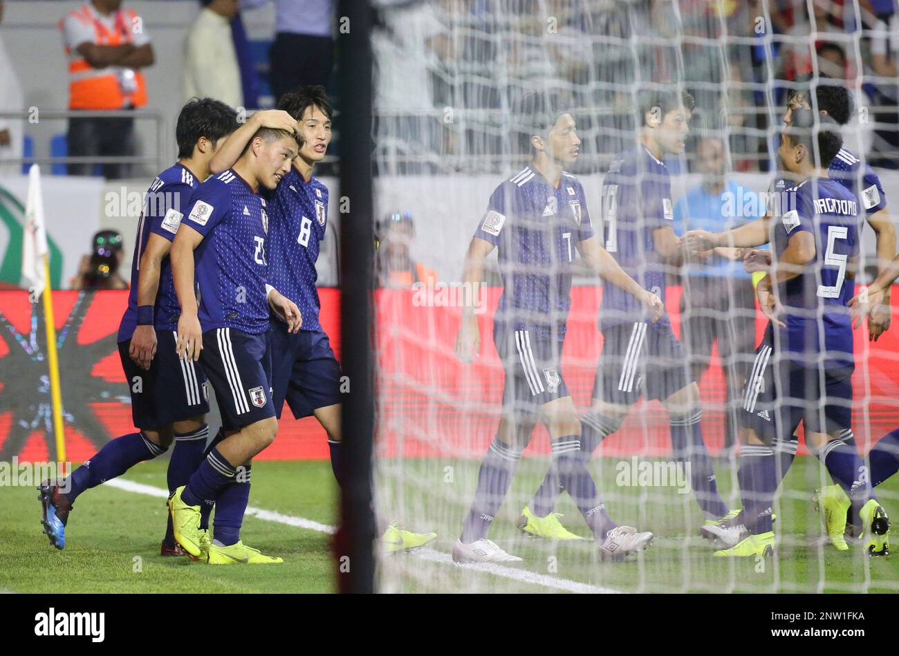Japan's Ritsu Doan (2nd from L, 22) reacts after scoring a goal in the ...