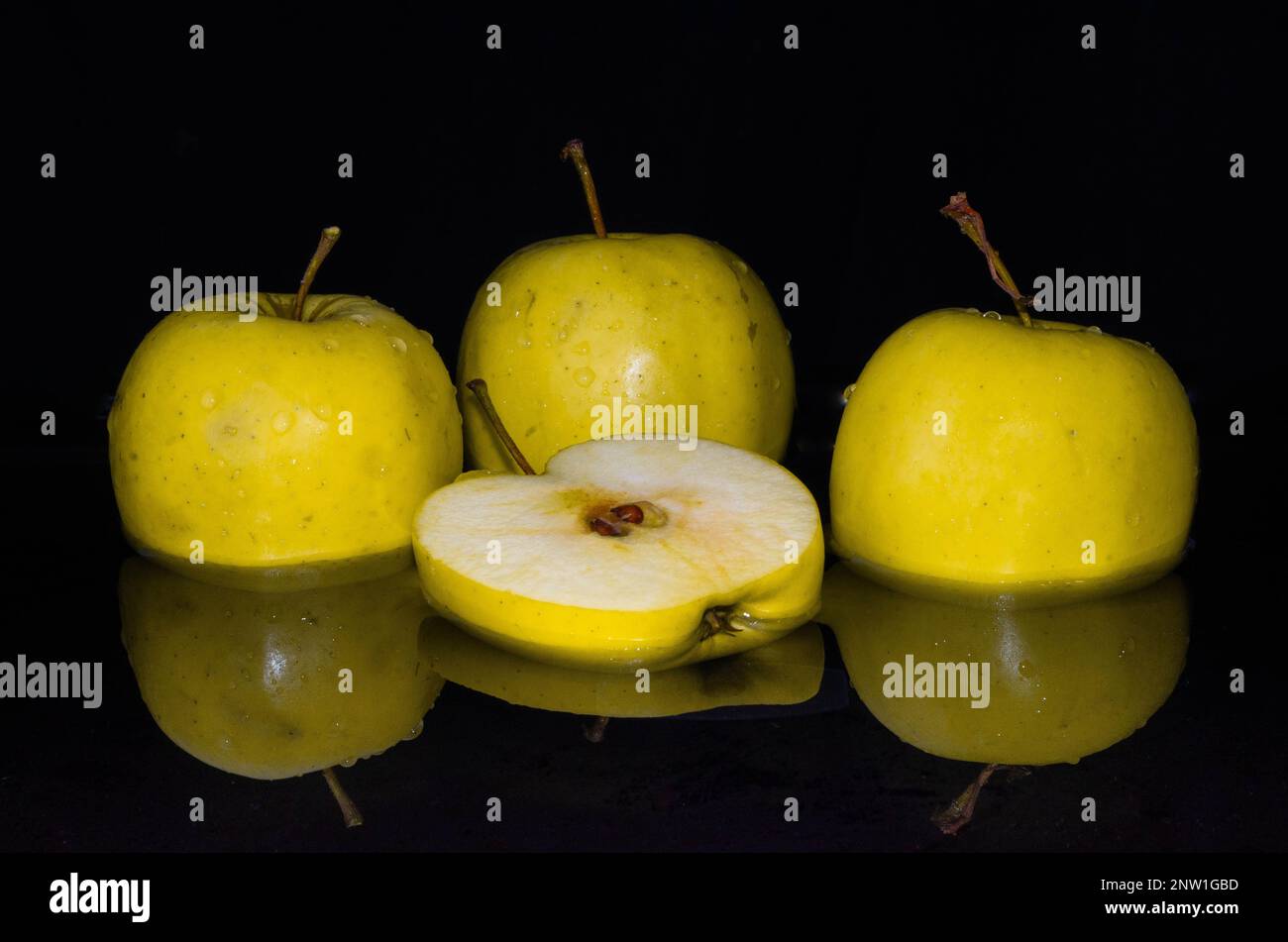 The freshly sliced yellow apples on a water surface Stock Photo - Alamy