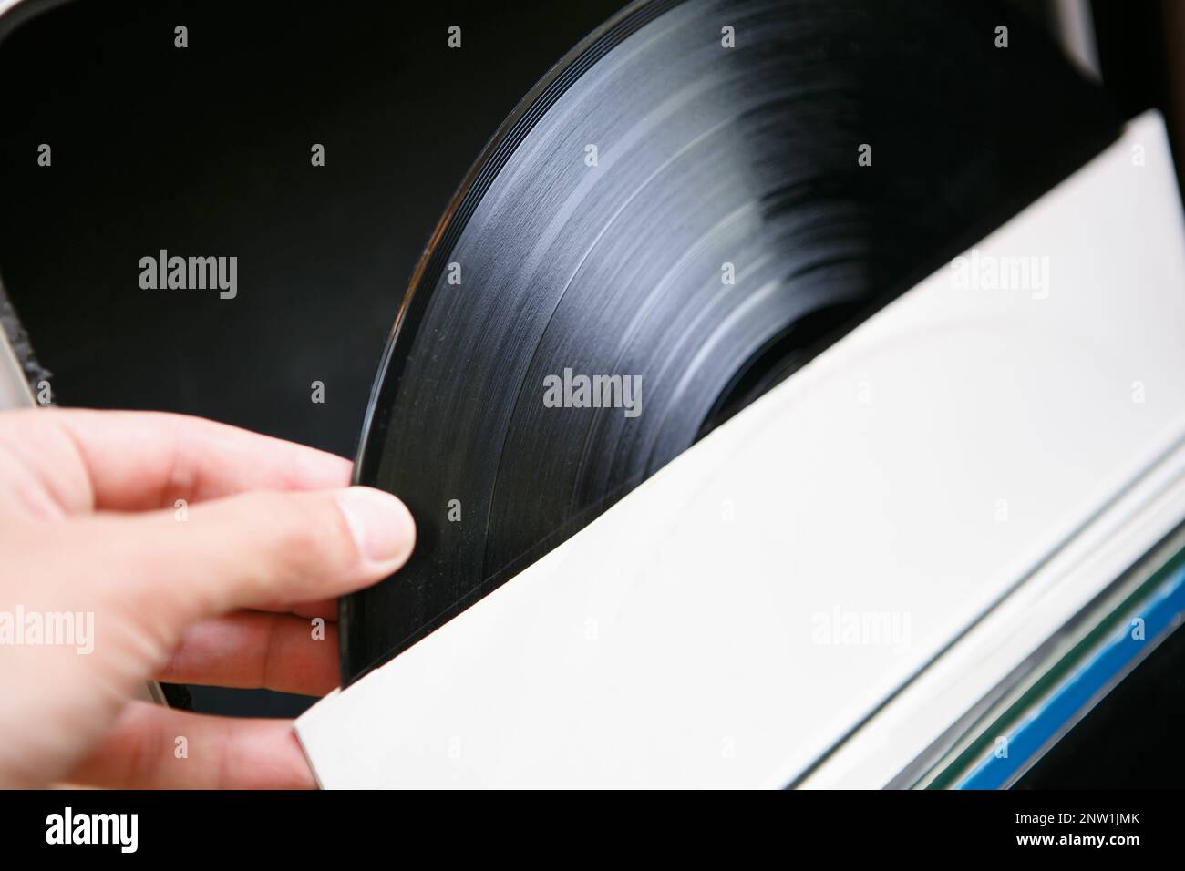 Hand holding vinyl record in hi-res stock photography and images - Alamy