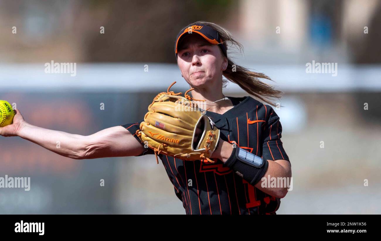 Oklahoma State second baseman Rachel Becker throws to first base during ...