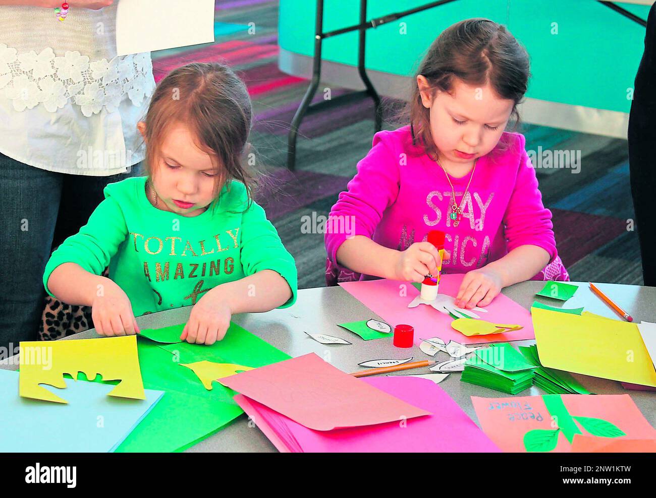 Using their hands as a pattern, youngsters create their own peace trees ...