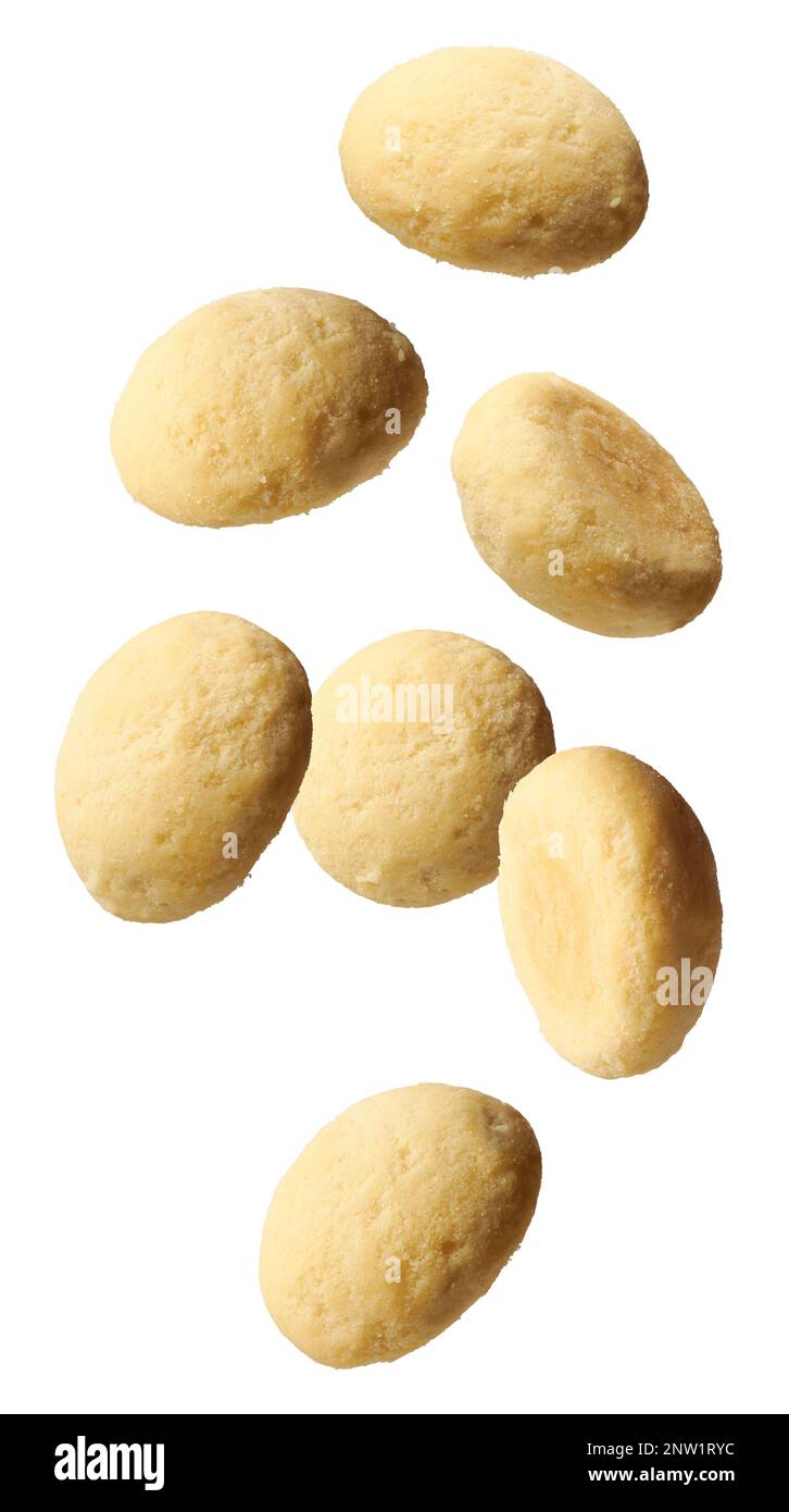 ghee biscuits or cookies falling isolated on white background, close-up ...