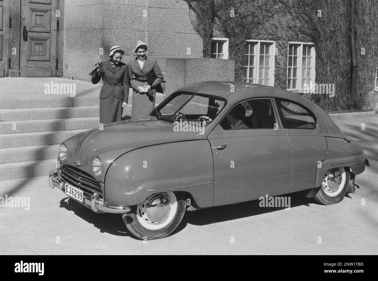 Car owner in the 1950s.The Saab model 92B car with a driver that stops ...