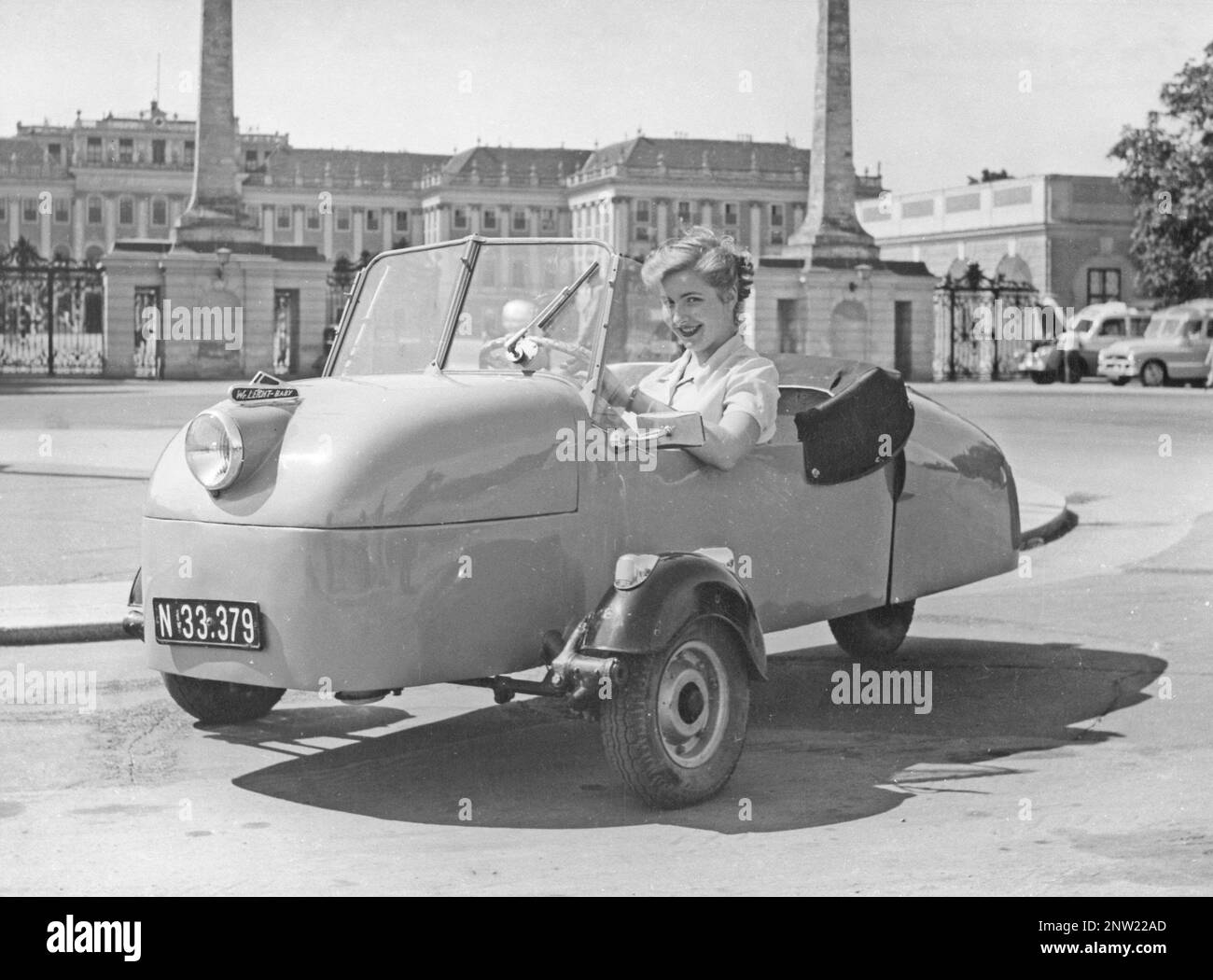 In the 1950s. A woman pictured in the driving seat of a mini three ...
