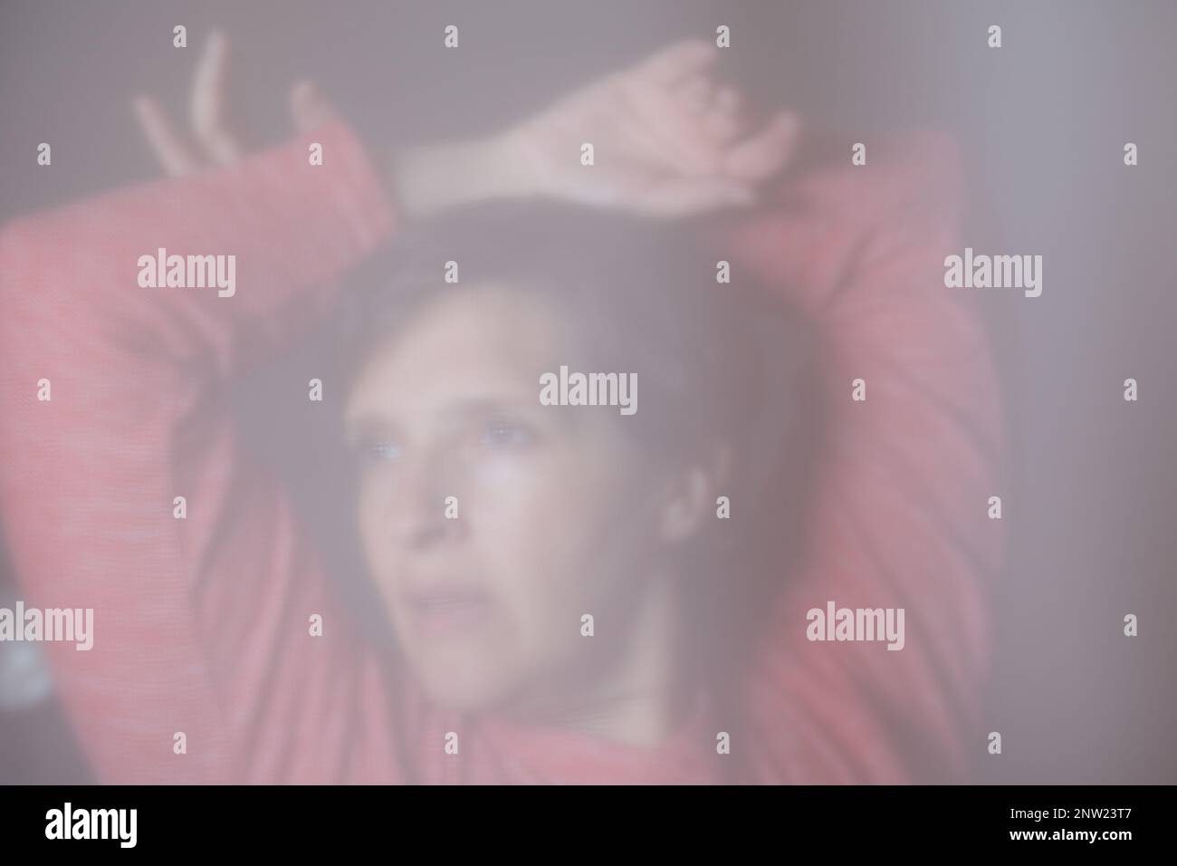 Woman behind sheer curtain hi-res stock photography and images - Alamy