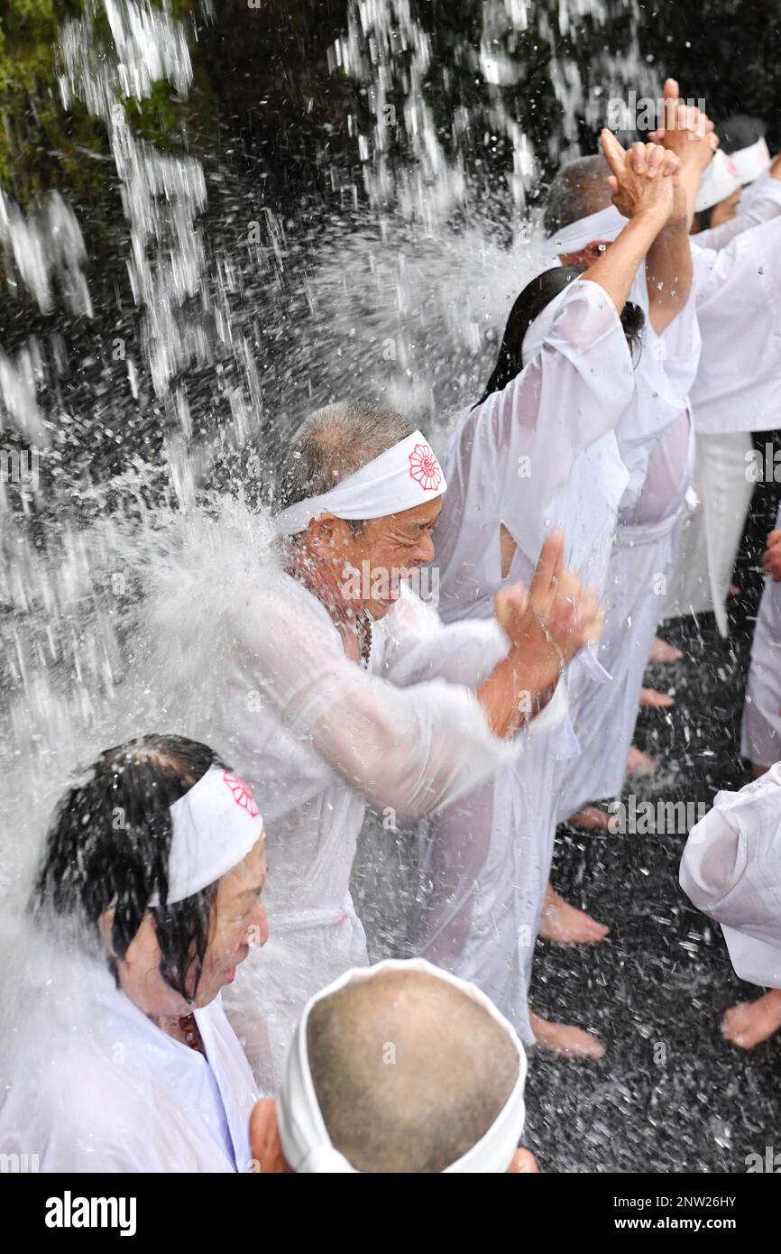 Practitioners of religious austerities and ascetic monks are standing ...