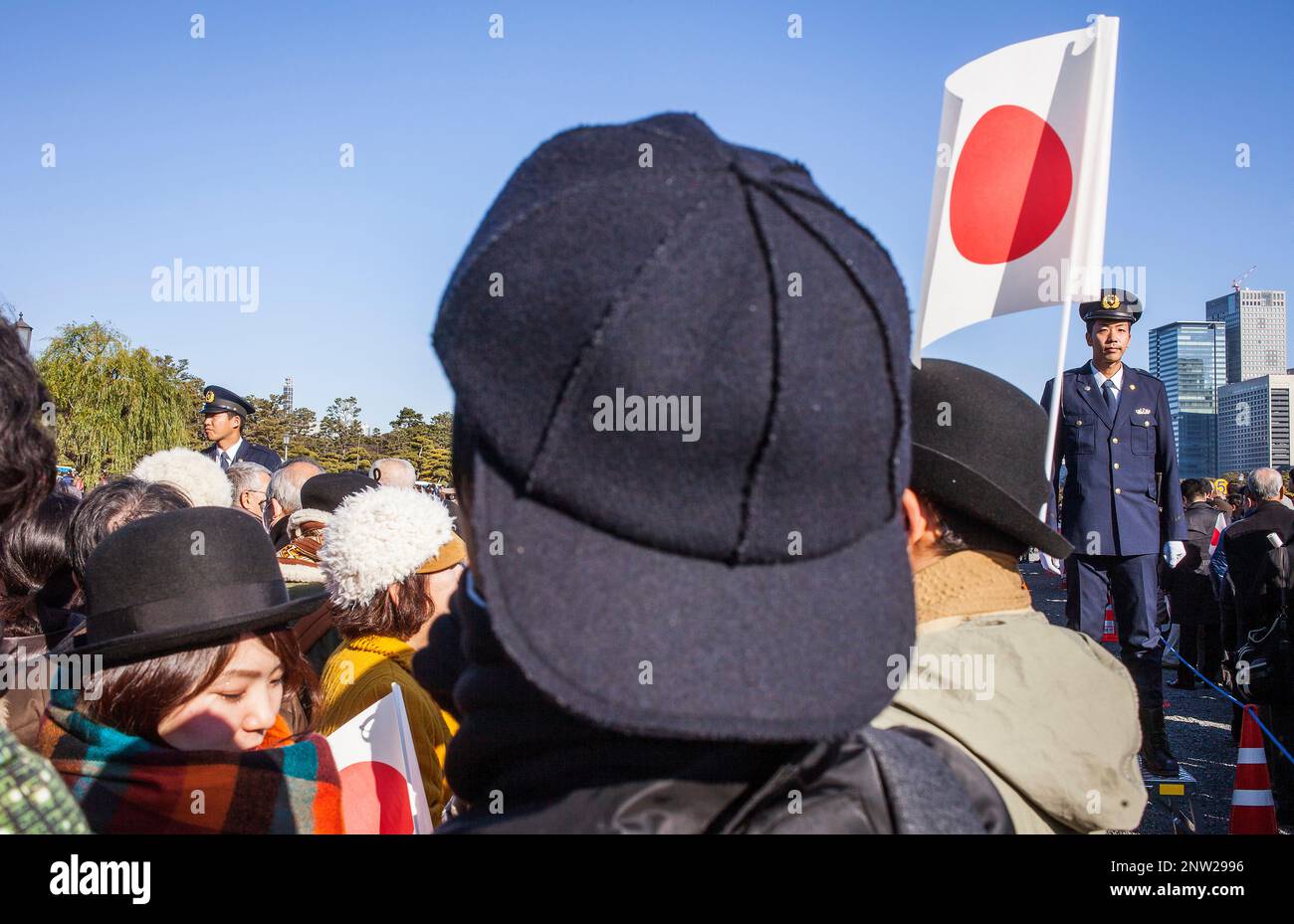 Police organize people queuing to enter at Imperial Palace. January 2 ...
