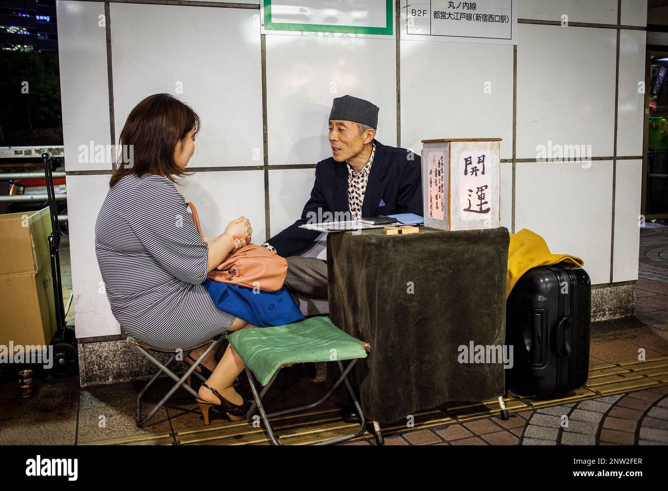 Reading hands, looking the future, next to Shinjuku station, Shinjuku ...