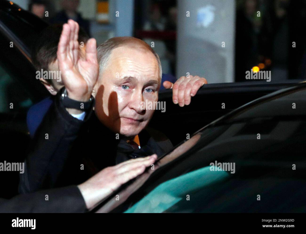Russia's President Vladimir Putin waves people as he leaves St. Sava ...