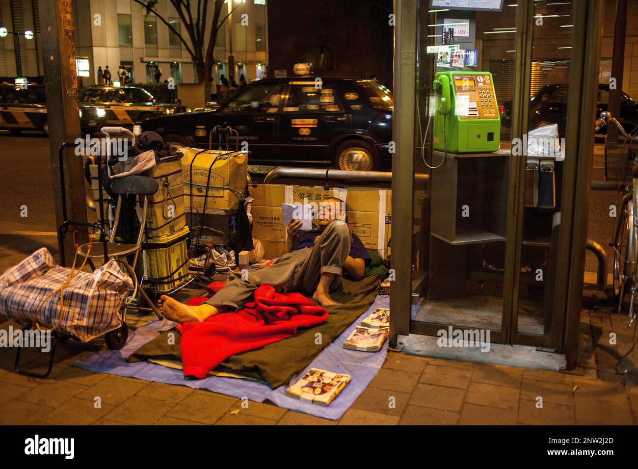 Homeless reading in Nishi Shinjuku.Shinjuku.Tokyo city, Japan, Asia ...
